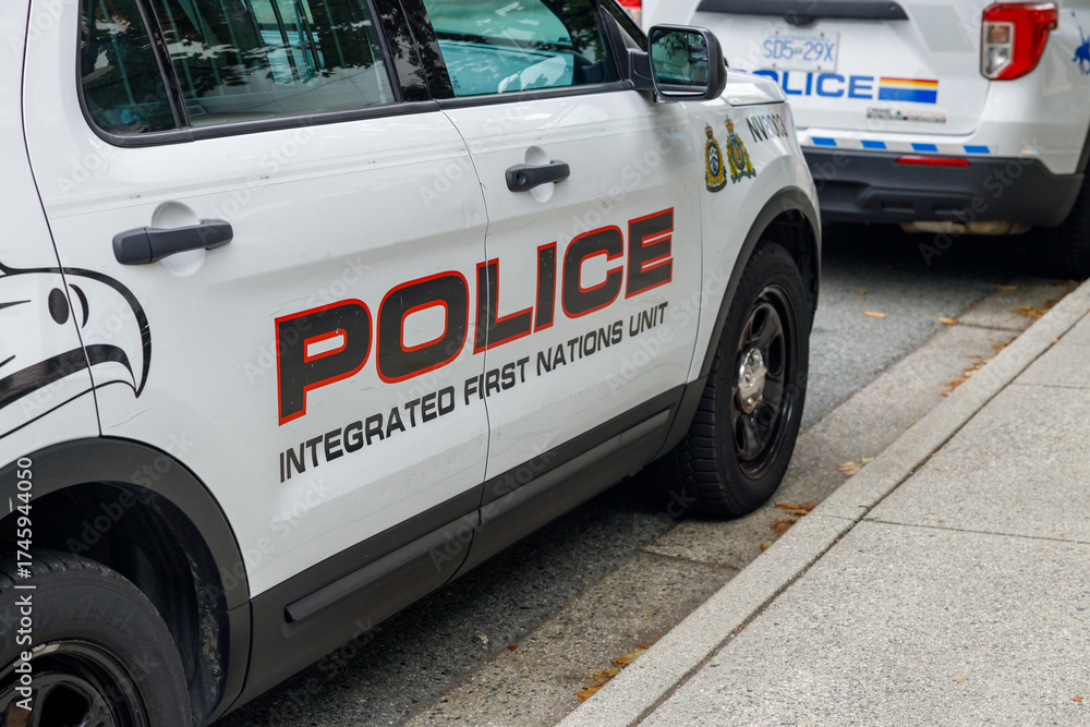 White police SUV marked "Integrated First Nations Unit" with eagle ...