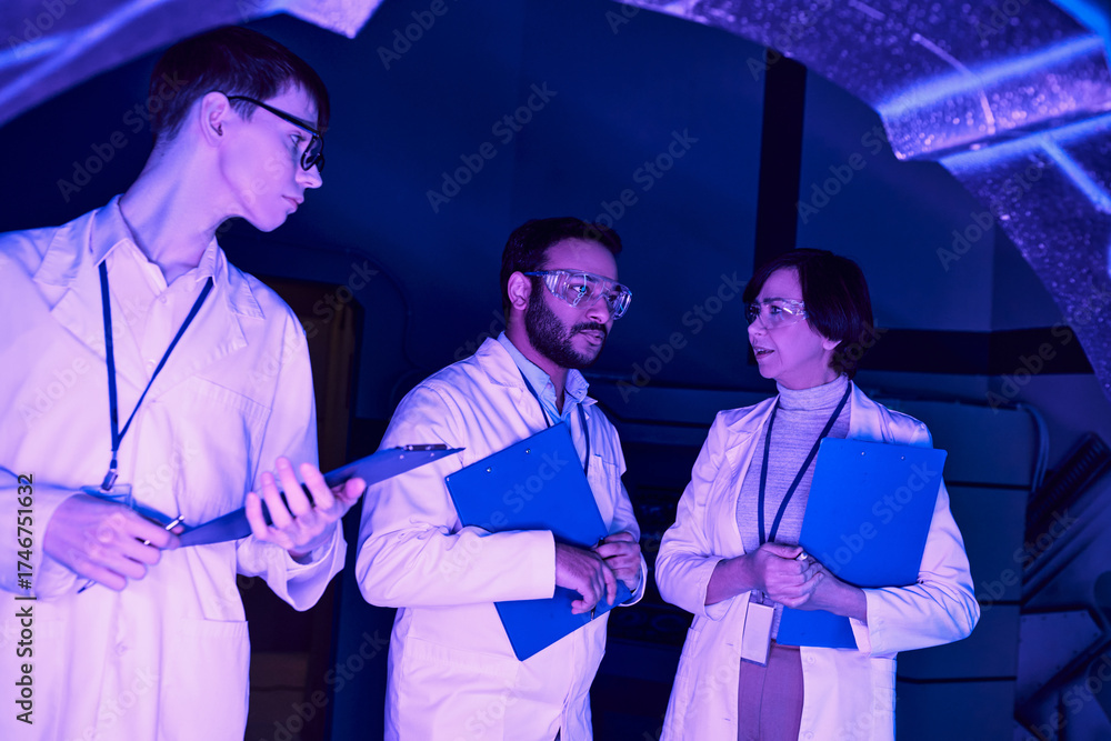 Scientists examining alien technology in a secretive lab environment at ...