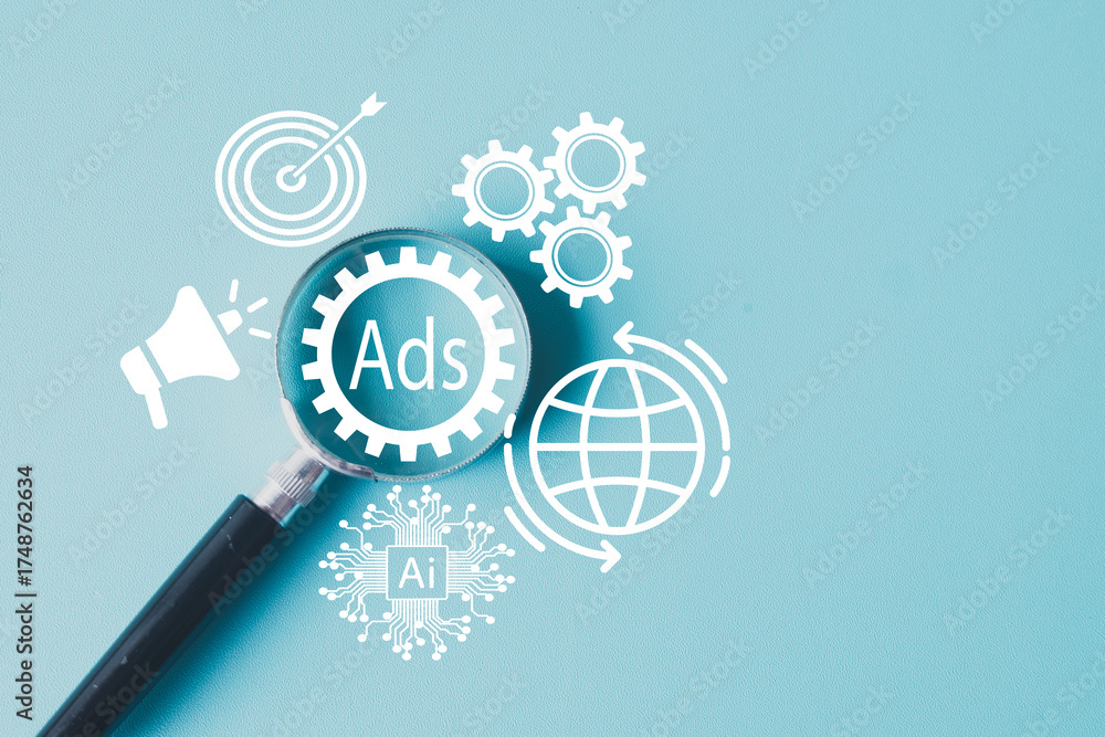 Advertising Technology (AdTech) concept. A magnifying glass focuses on ...