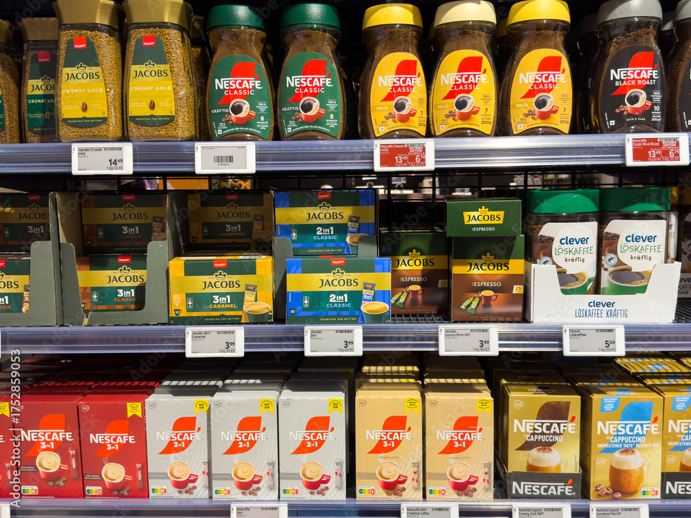 Variety of instant coffee products displayed on supermarket shelf ...