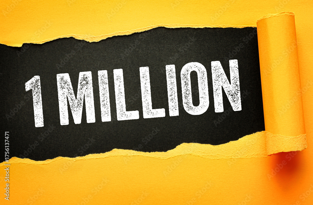 1 MILLION written in bold textured letters is revealed under torn paper ...