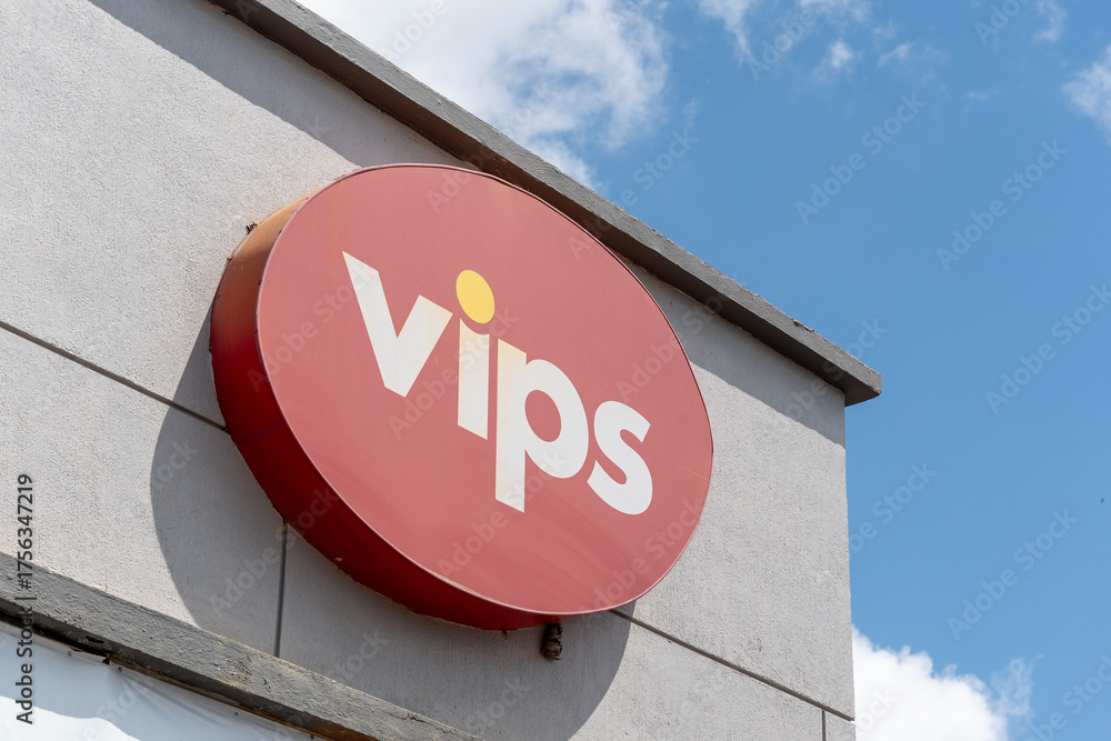 Facade of a Vips restaurant, featuring its logo over the main entrance ...