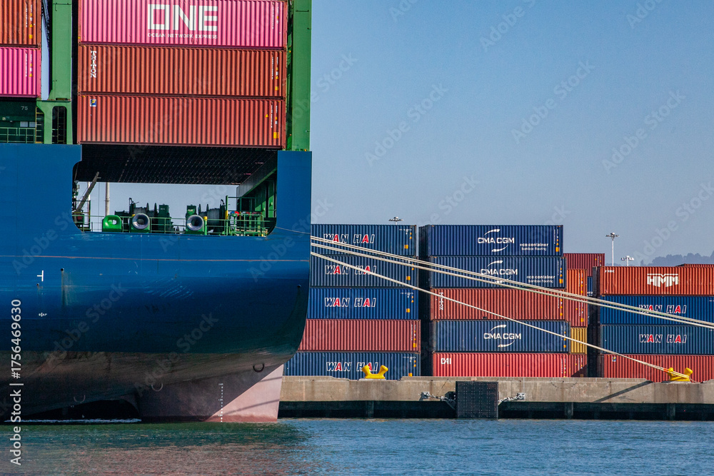 Docked cargo ship with anchor ropes at Port of Oakland highlights ...