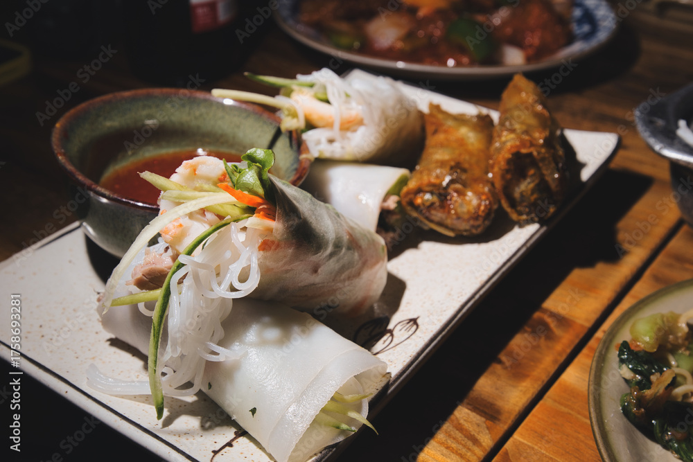 Assortment of vietnamese fresh goi cuon and crispy cha gio with sweet ...