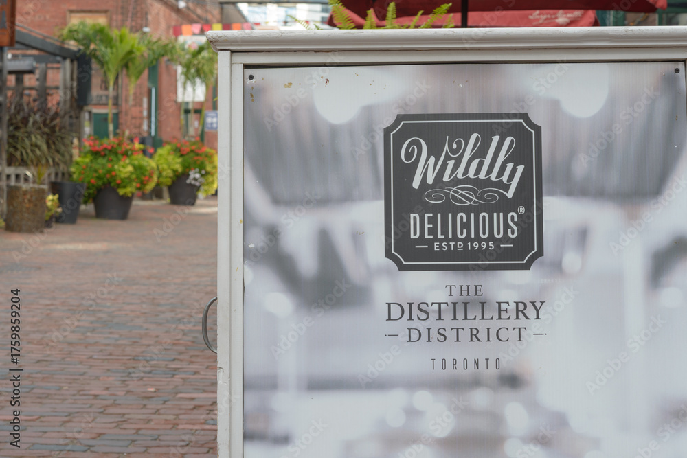 sidewalk sign outside Wildly Delicious Fine Foods, a gourmet grocery ...