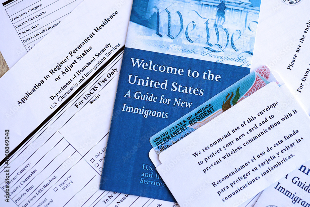 Permanent resident green card in envelope with application and guide ...