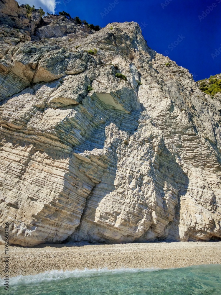 Zakintos, Greece - September 19,2025 : A rocky cliff with layered ...
