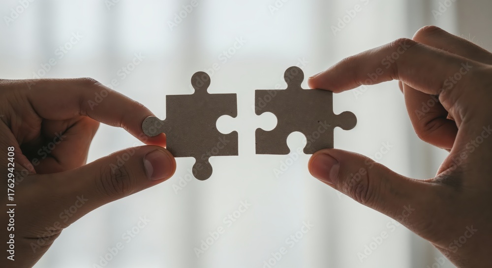 Puzzle Solution: Two hands holding interlocking puzzle pieces symbolize ...