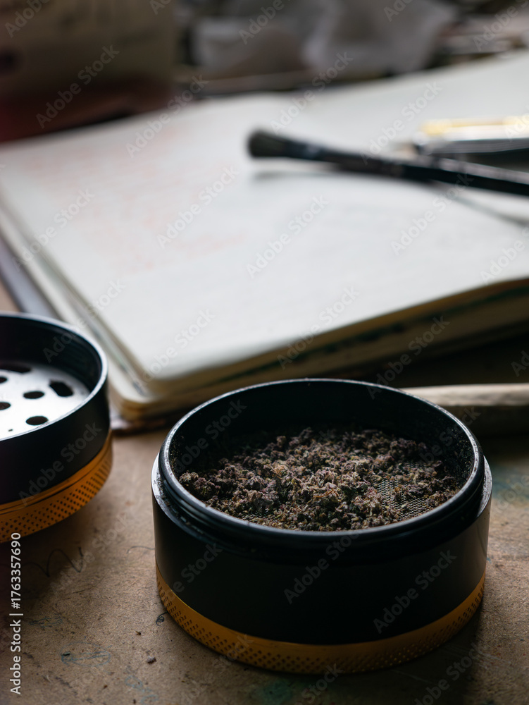Cannabis Grinder Showing Finely Ground Marijuana with Rolling Papers ...