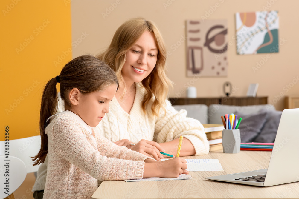 Female tutor giving lesson to cute little girl at home Stock Photo ...