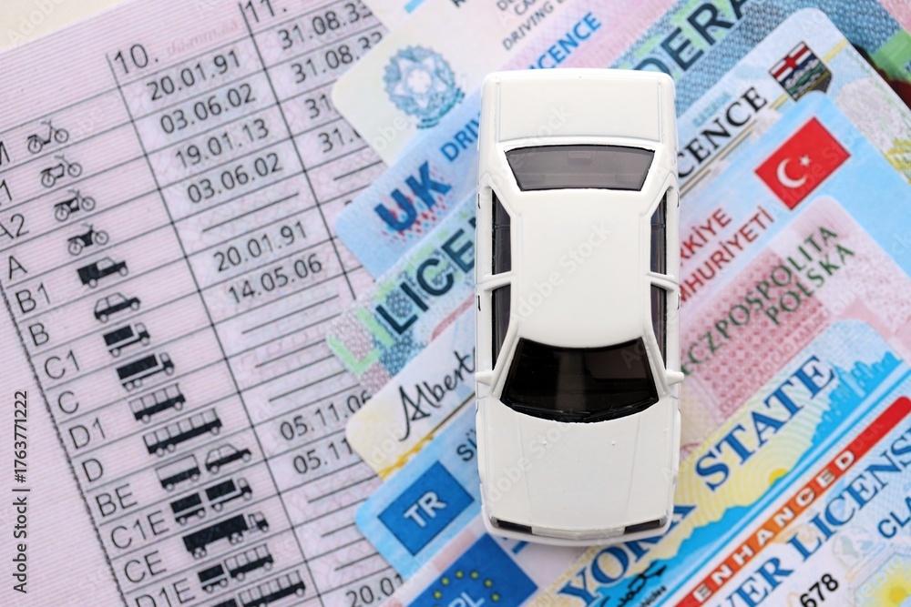 Toy car on driving licenses from different countries and American ...