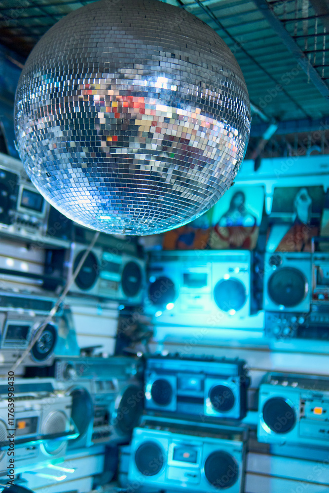 Audio product scene from the 70s and 80s. A silver disco ball lights up ...