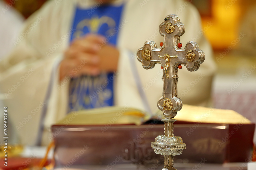 Holy Cross with Jesus Christ on the altar during the Holy Mass, the ...