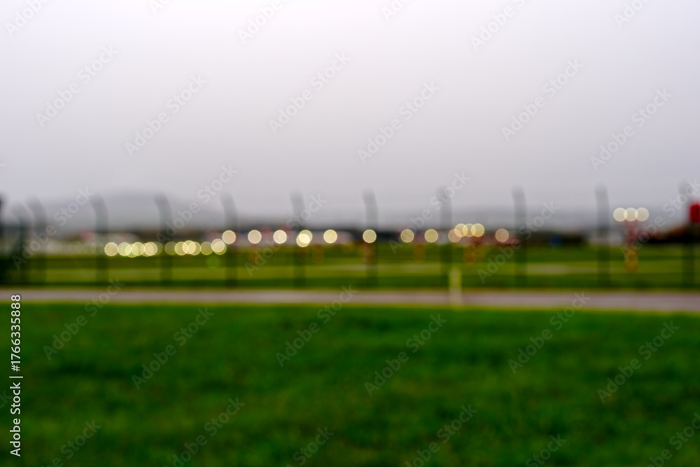 Bokeh lights of beacon seen trough barbed wire fence at Swiss Zürich ...
