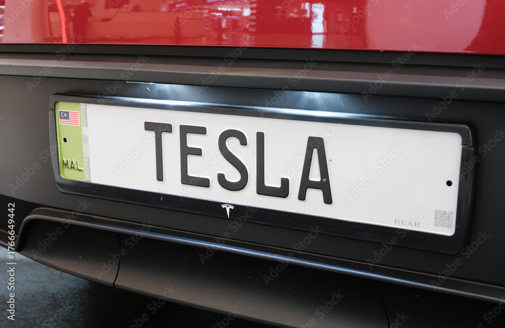 Tesla license plate on a red vehicle in Penang Stock Photo | Adobe Stock