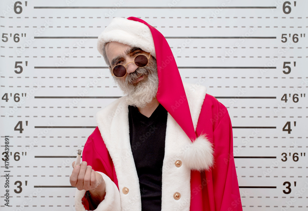 Photo Stock Bad Santa Claus smoking a hand-rolled cigarette, Police ...