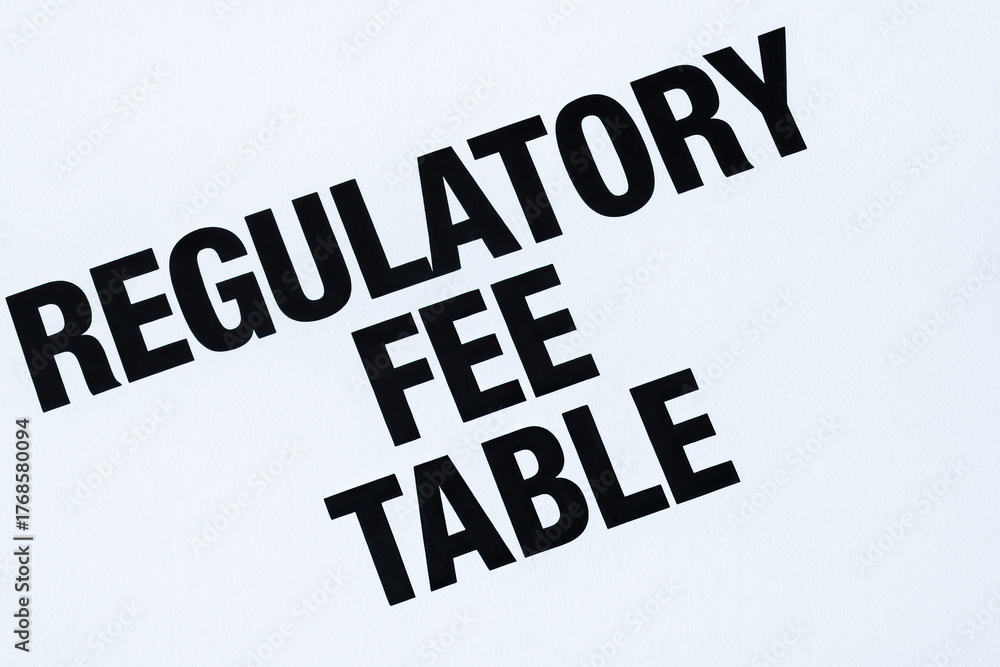 Rare earth tones emphasize bold black regulatory fee table text on ...