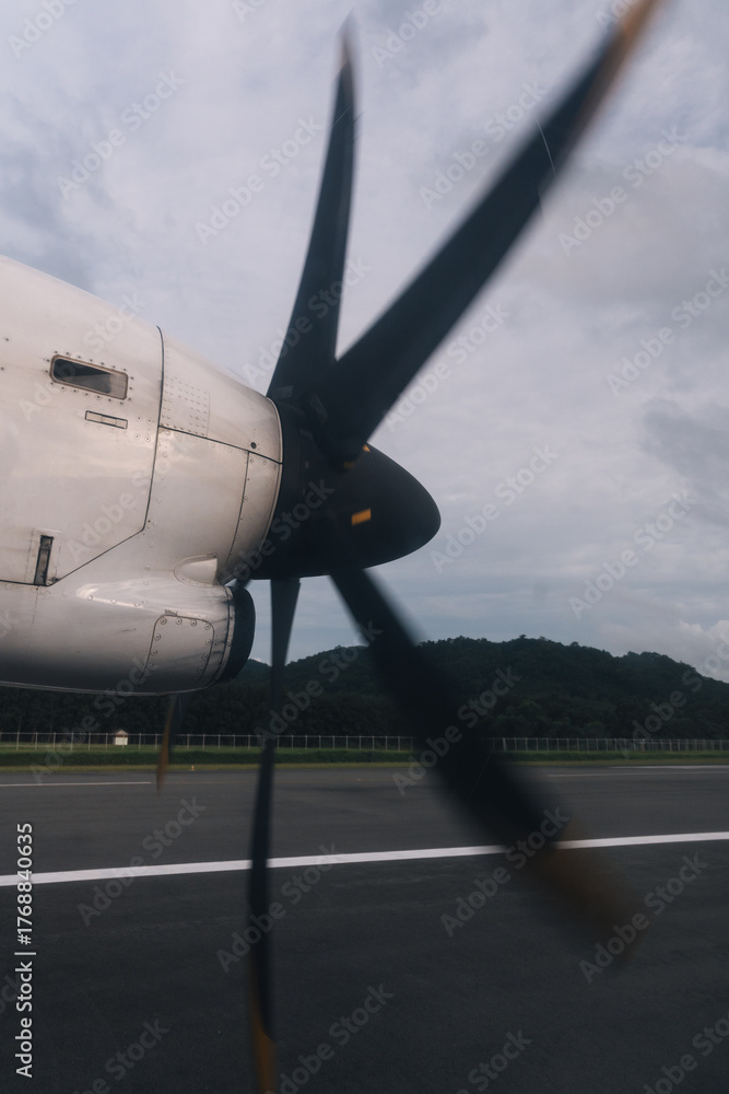 Turboprop airplane engine with spinning propeller ready for take off on ...