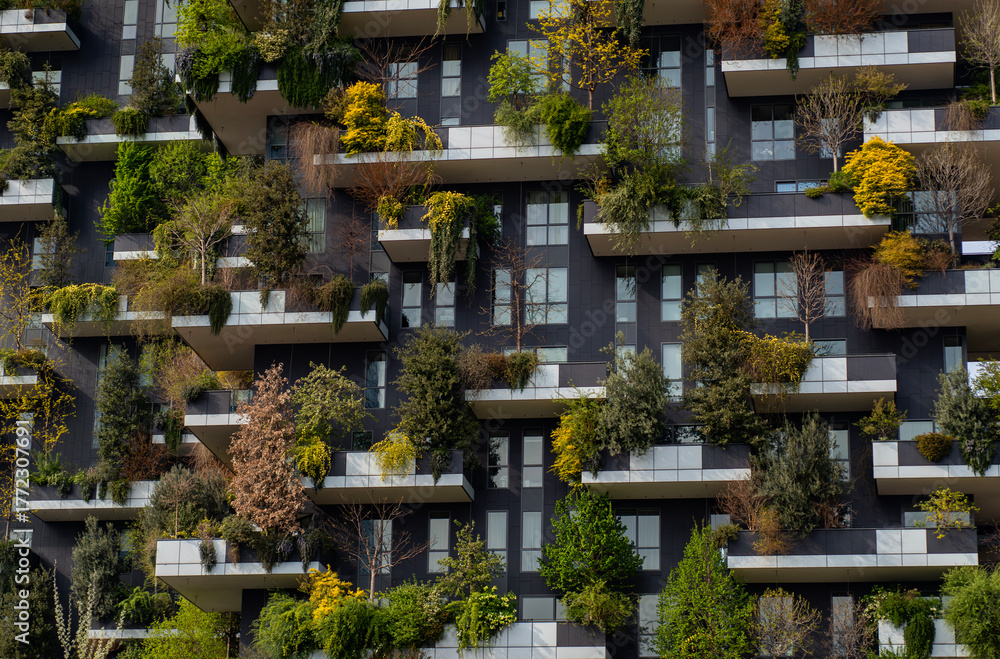 Green building with trees represents modern architecture in Milan ...