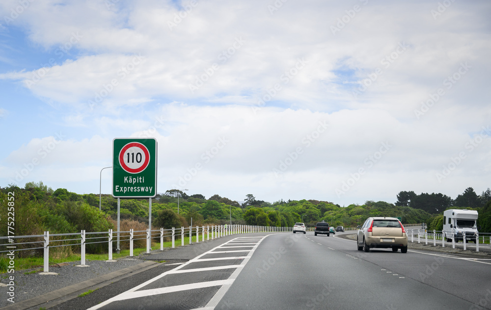 110 km/h speed limit road sign at Kapiti Expressway. Cars and Motorhome ...