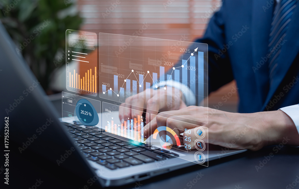 Businessman using laptop to analyze performance with business analytics ...