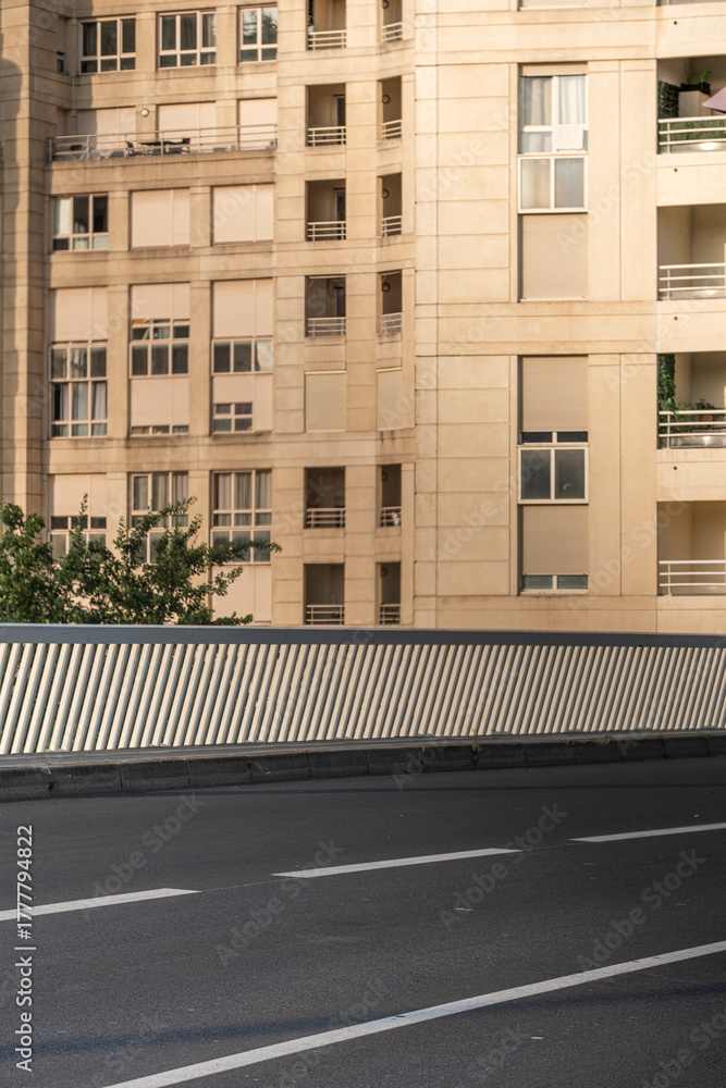 Wide empty public plaza defined by minimal urban architecture and ...