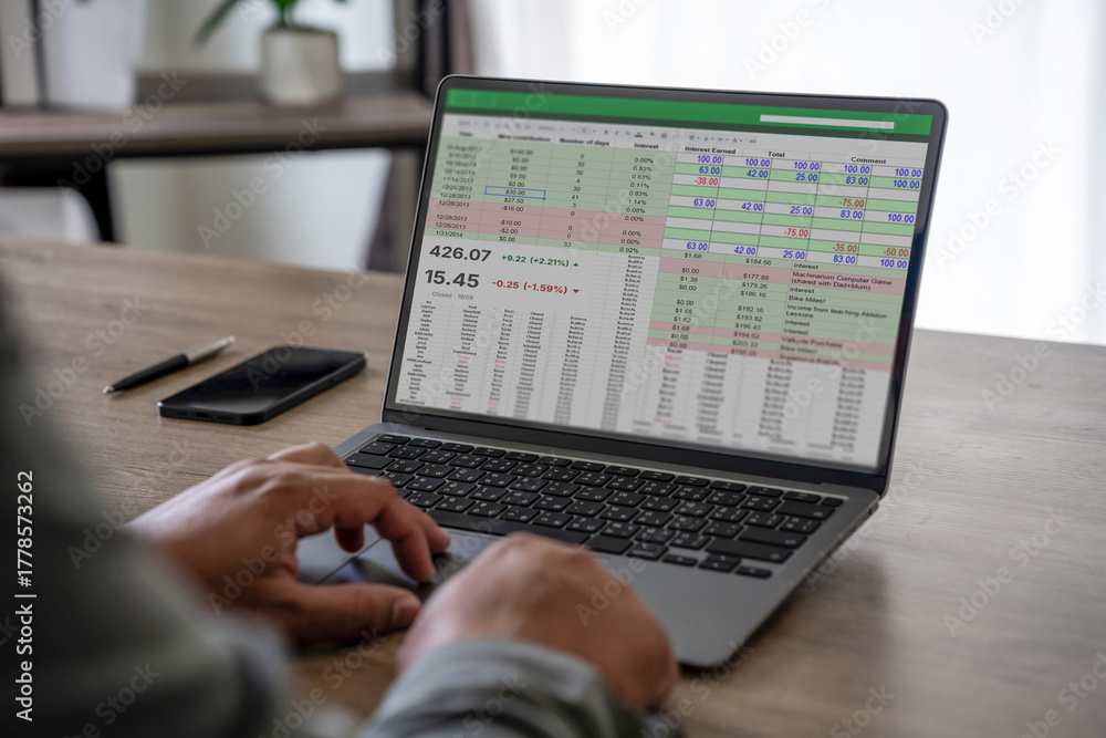 businessman working with data and graphs in spreadsheet documents for ...