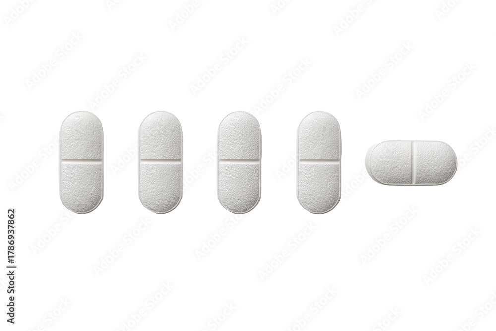 Five white oval pills in a row Stock Photo | Adobe Stock