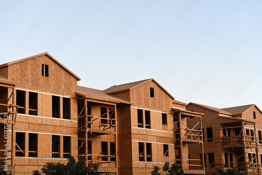 Wood-frame construction of multi-story apartment buildings in early ...
