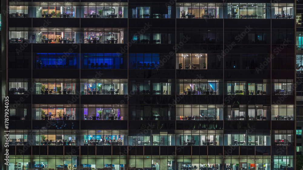 Modern office building with big windows at night timelapse, in windows ...
