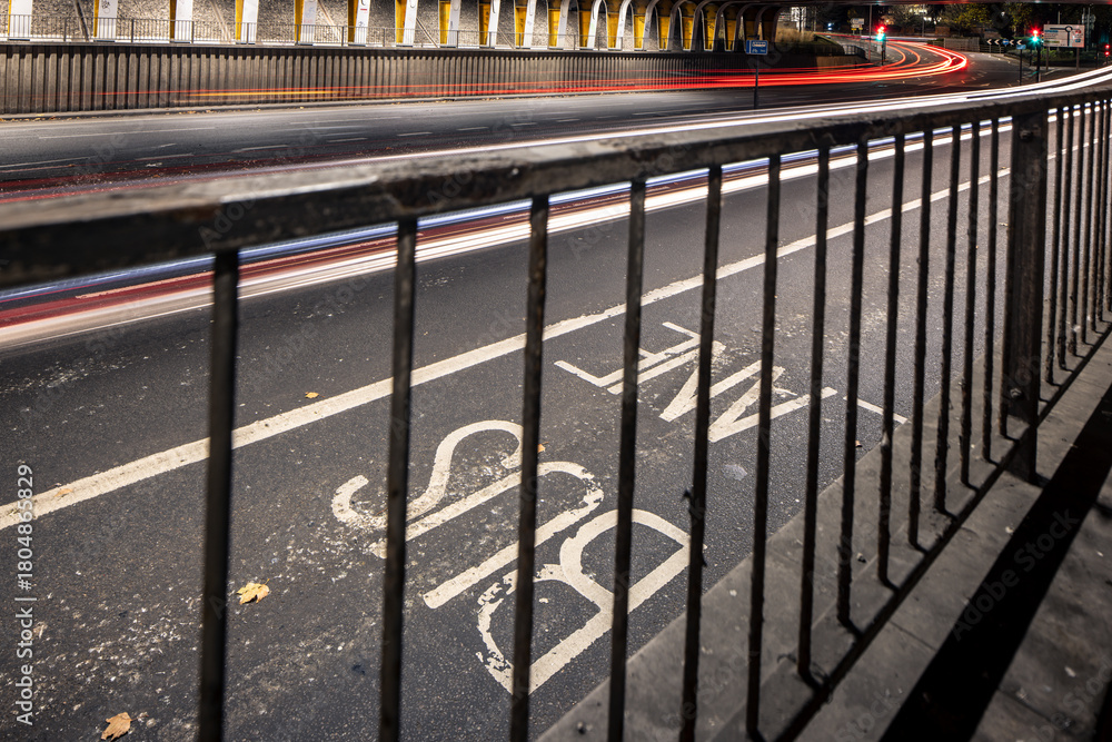 An overhead, diagonal view of a multi-lane roadway with "BUS LANE ...