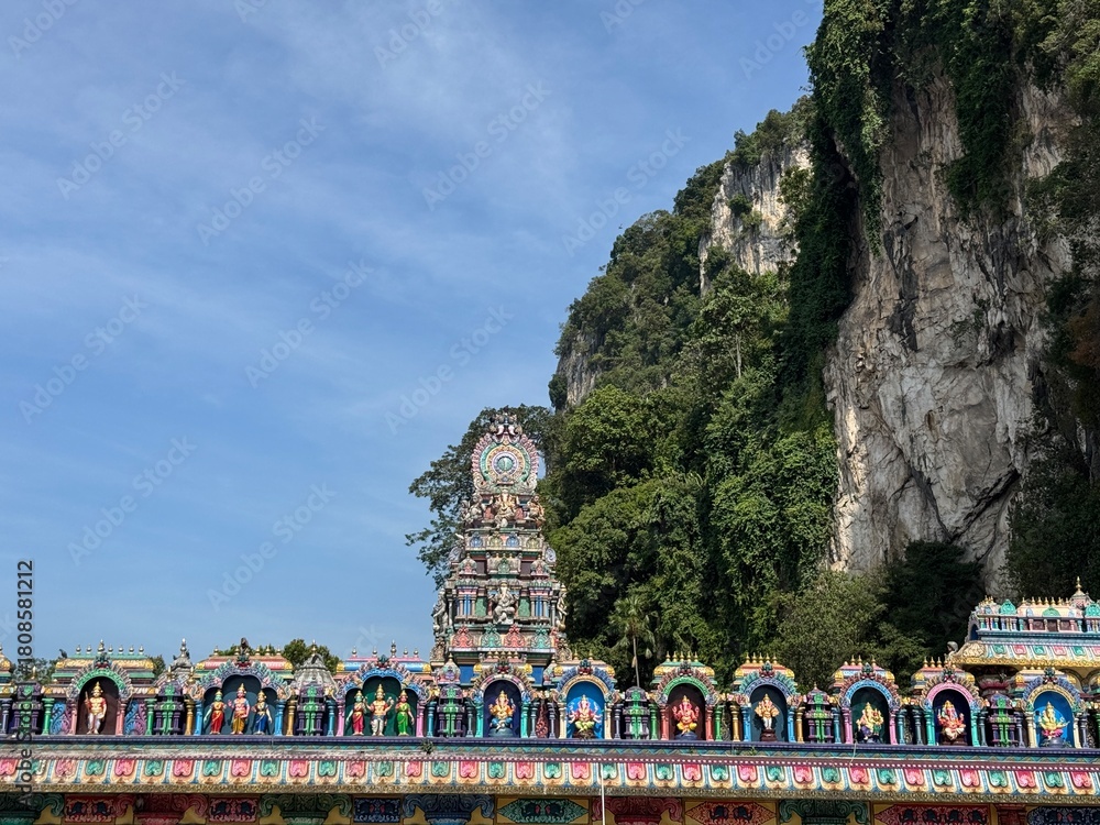Colorful Hindu Temple Gopuram at the Base of the Dramatic Limestone ...