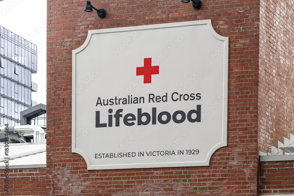The sign of Australian Red Cross Lifeblood displayed on a brick ...