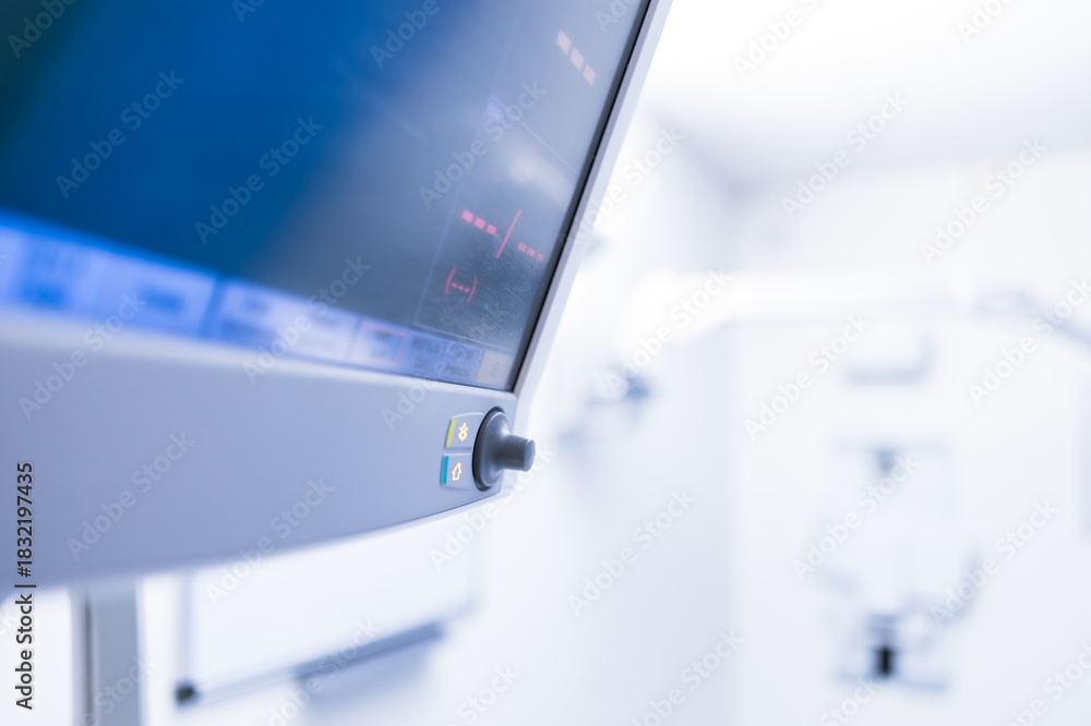 Shallow focus of the rotary brightness dial of a cardiac monitor seen ...