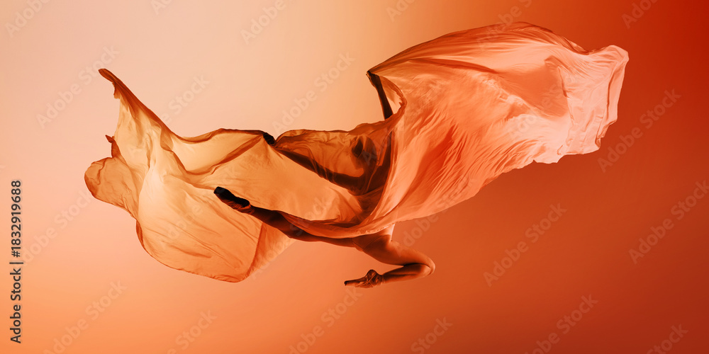 Stock-Foto „Ballet dancer floating under large orange fabric wave on ...