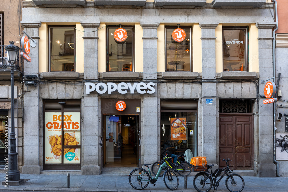 Madrid, spain; 11 05 2025 popeyes fast food restaurant storefront with ...