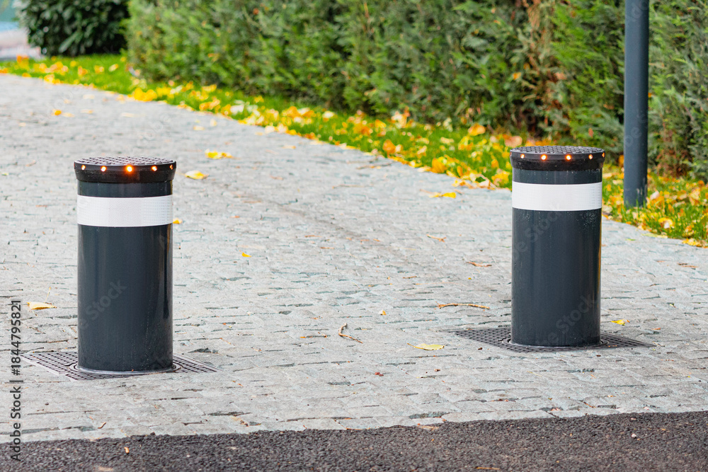 Retractable bollards providing security and traffic control on a paved ...