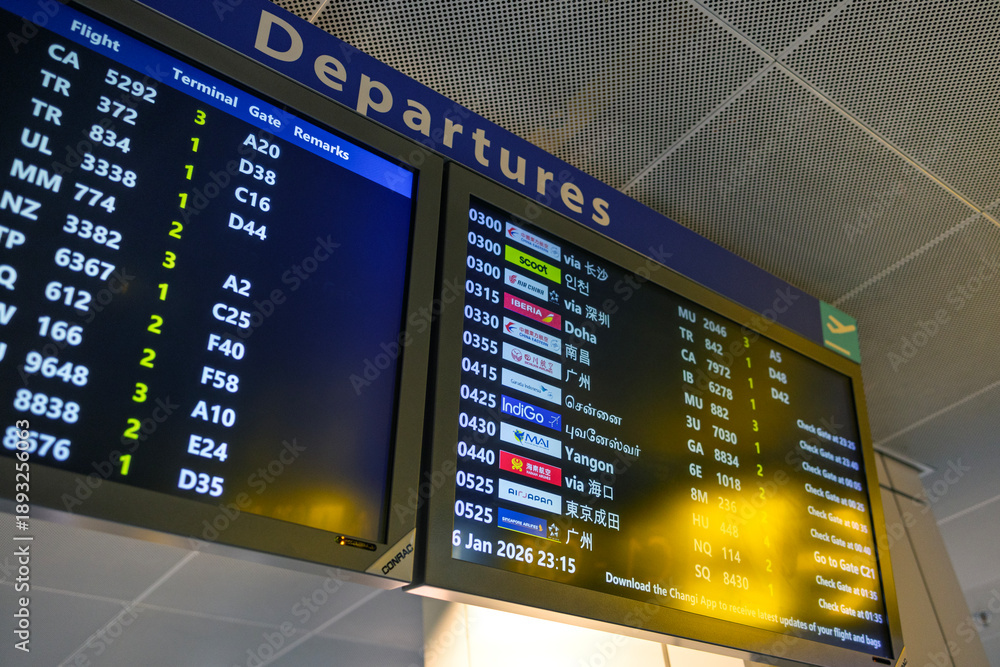 Changi, Singapore – Jan 6, 2026: A digital departure information board ...