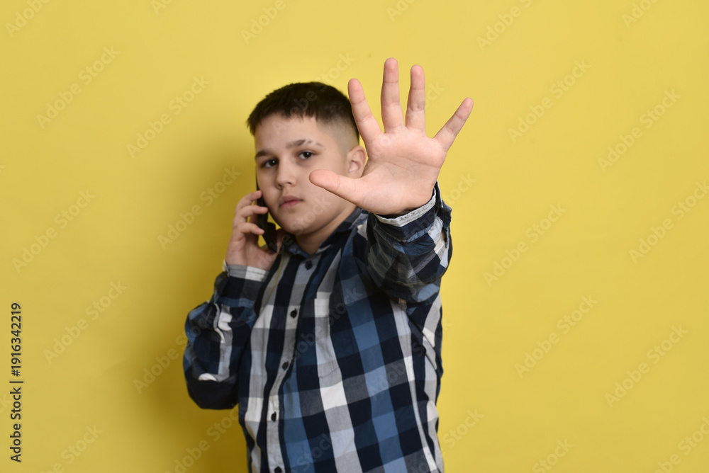 Young boy victim of phone harassment, showing the concept of ...