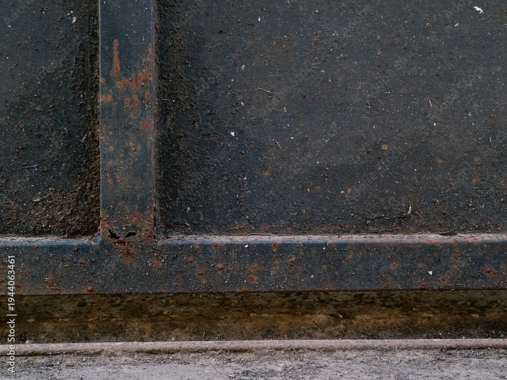 Close-up view of a rusty metal surface with corrosion and a dirty ...