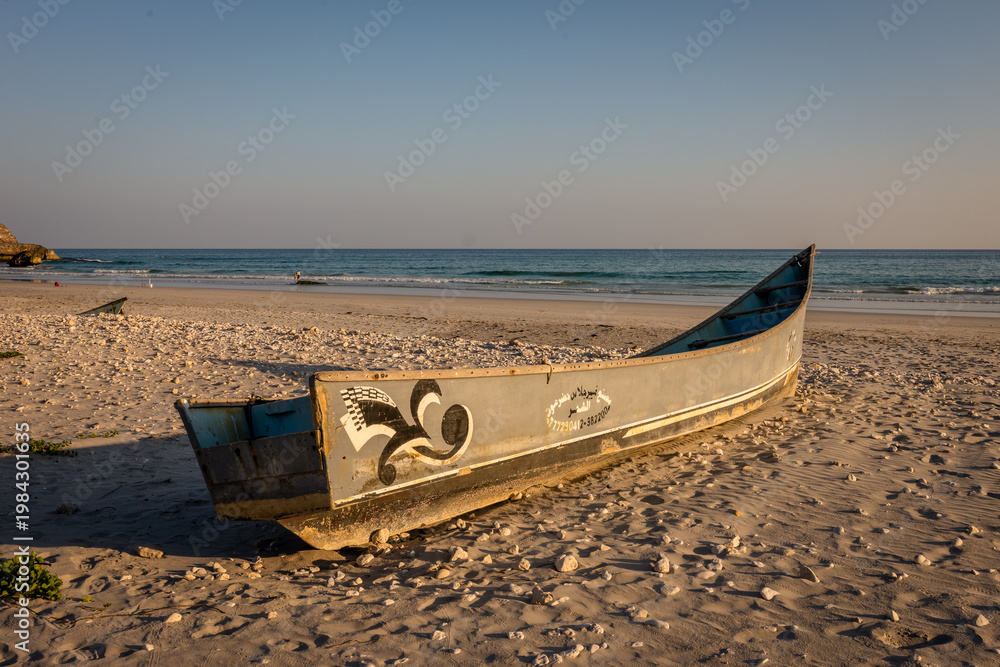 Traditional Omani Fishing Boat Washed Ashore on a Scenic Beach in Oman ...