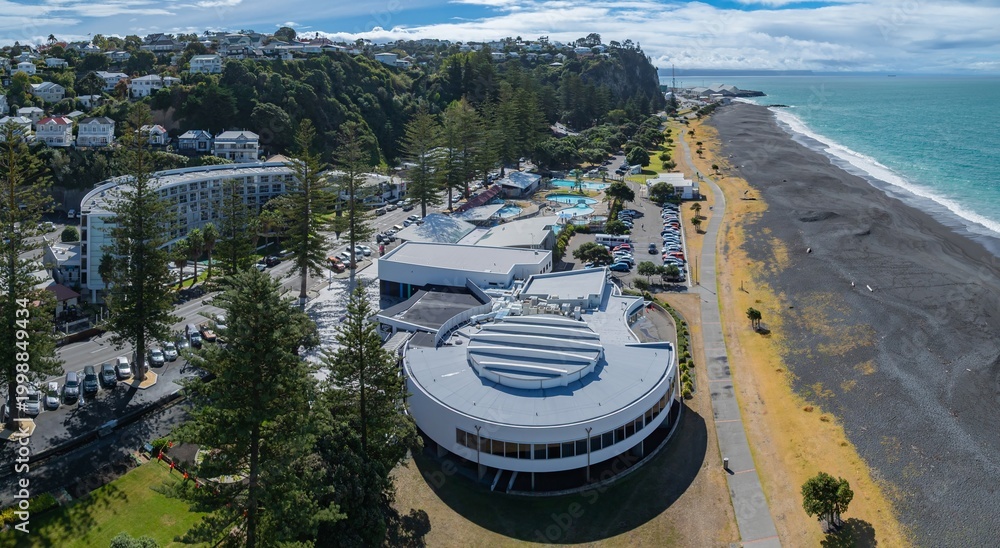 Foto de Stock Aerial view of the beach front buildings and black sand ...