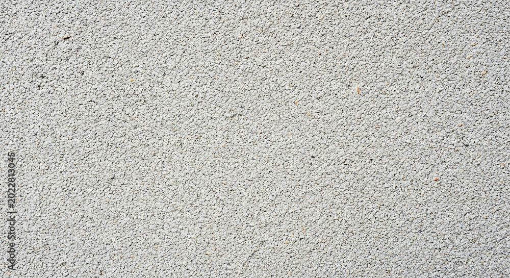 Granular light gray concrete texture showing a detailed rough surface ...