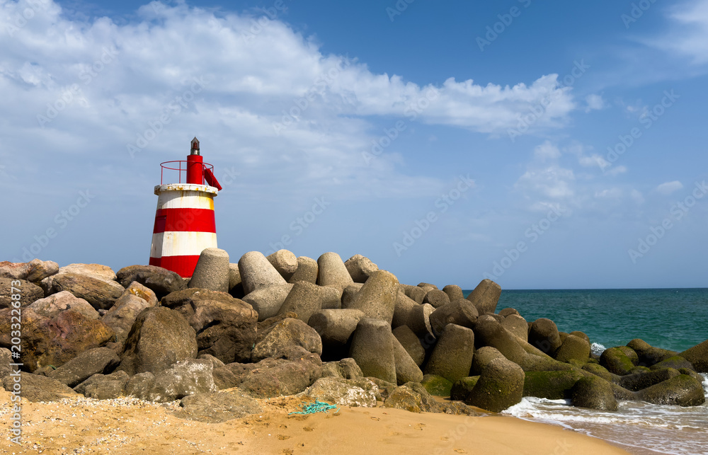 Praia da Ilha de Tavira, Portugal Lighthouse of the Tavira west jetty ...
