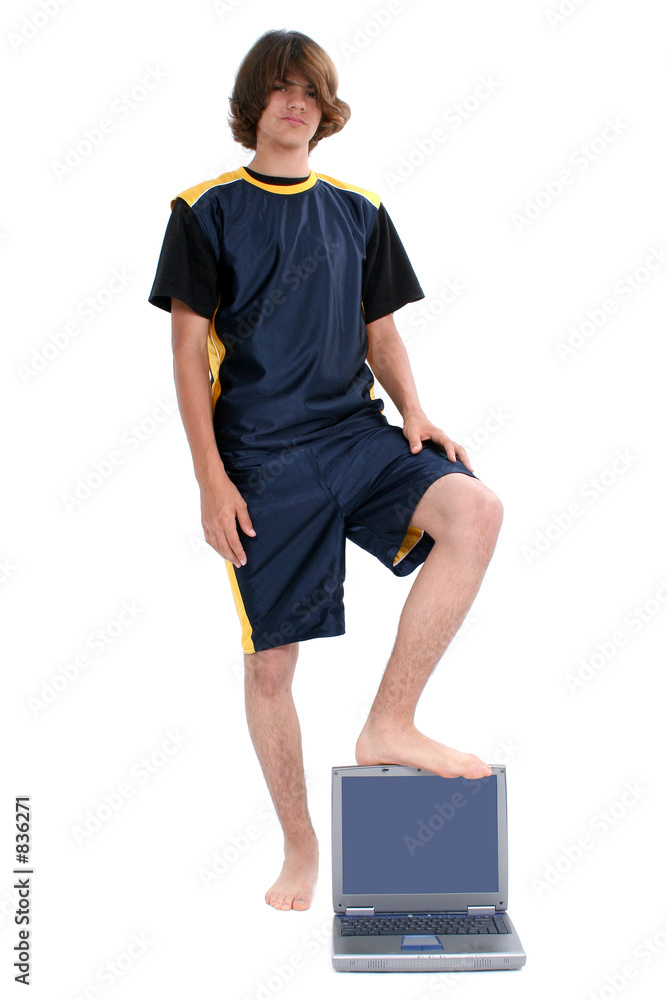 barefoot teen boy standing with laptop computer ov Stock Photo | Adobe ...