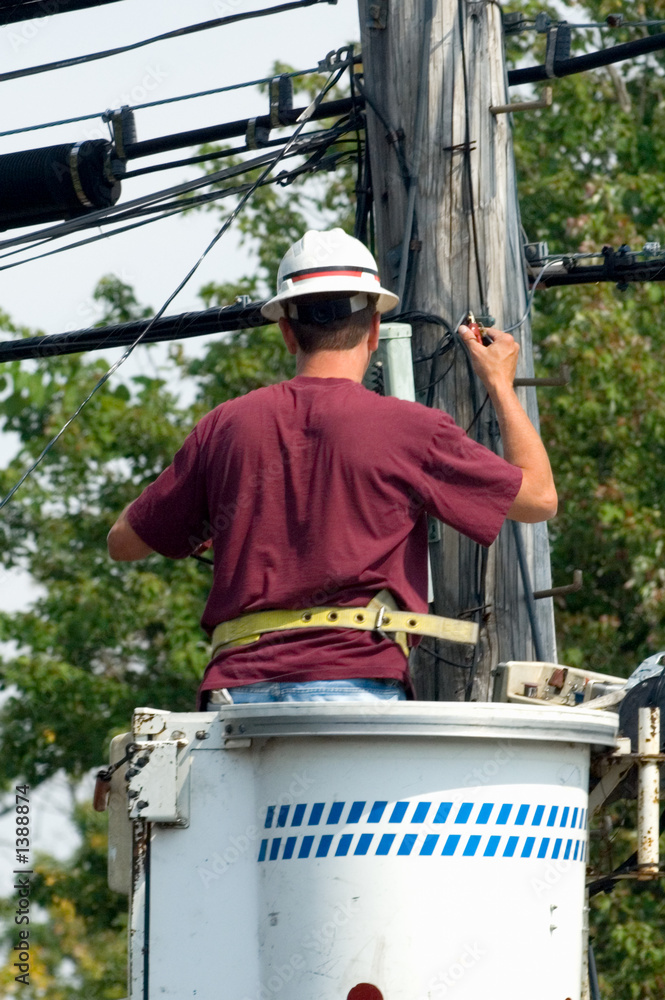 lineman tapping into a telephone line Stock Photo | Adobe Stock