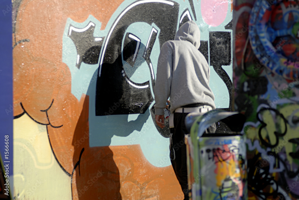 spraying graffiti Stock Photo | Adobe Stock