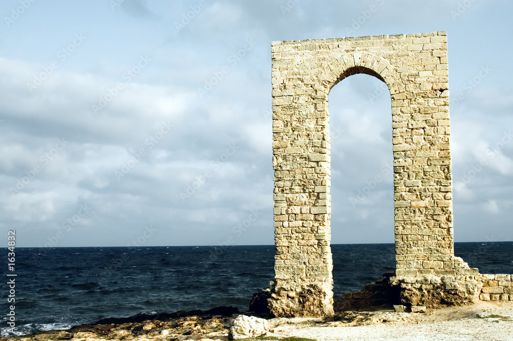 ancient arch - ruins over seashore, front view Stock Photo | Adobe Stock