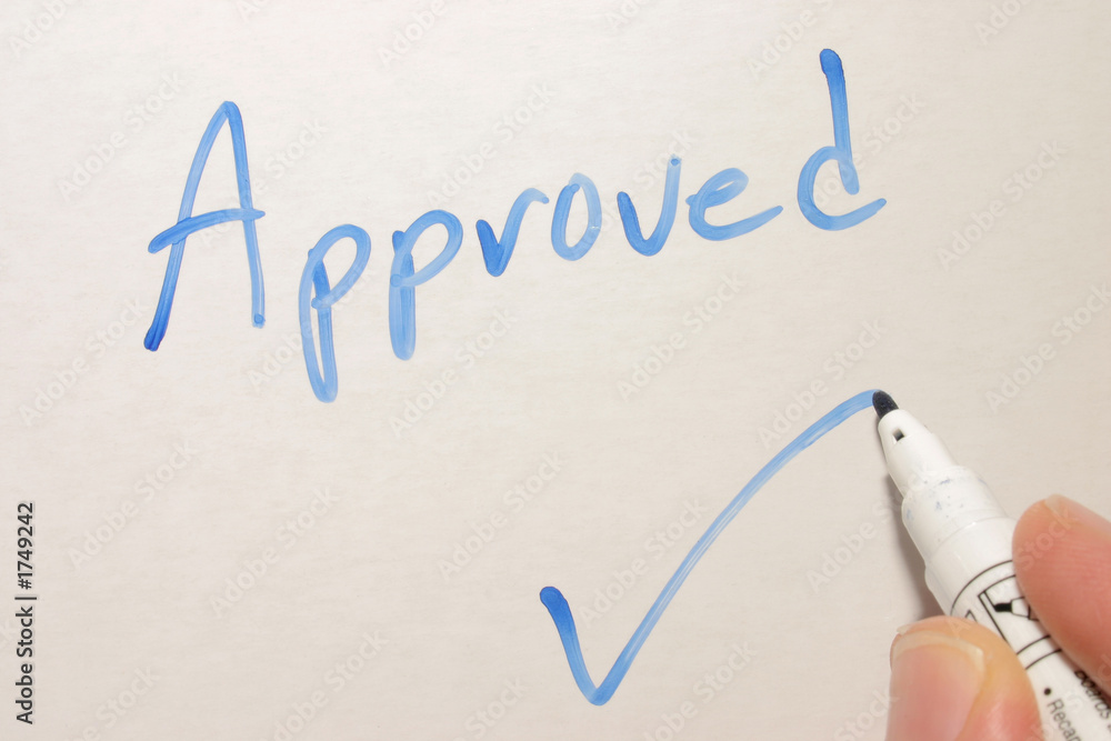 approved, written on an office whiteboard. Stock Photo | Adobe Stock