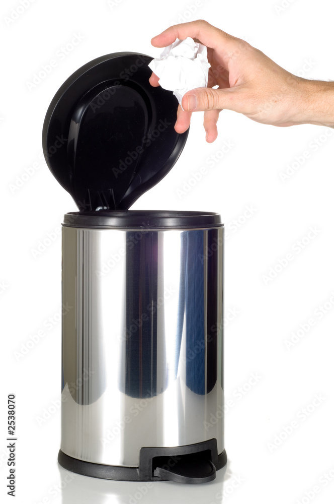 man's hand disposing of trash in stainless steel trash can Stock Photo ...